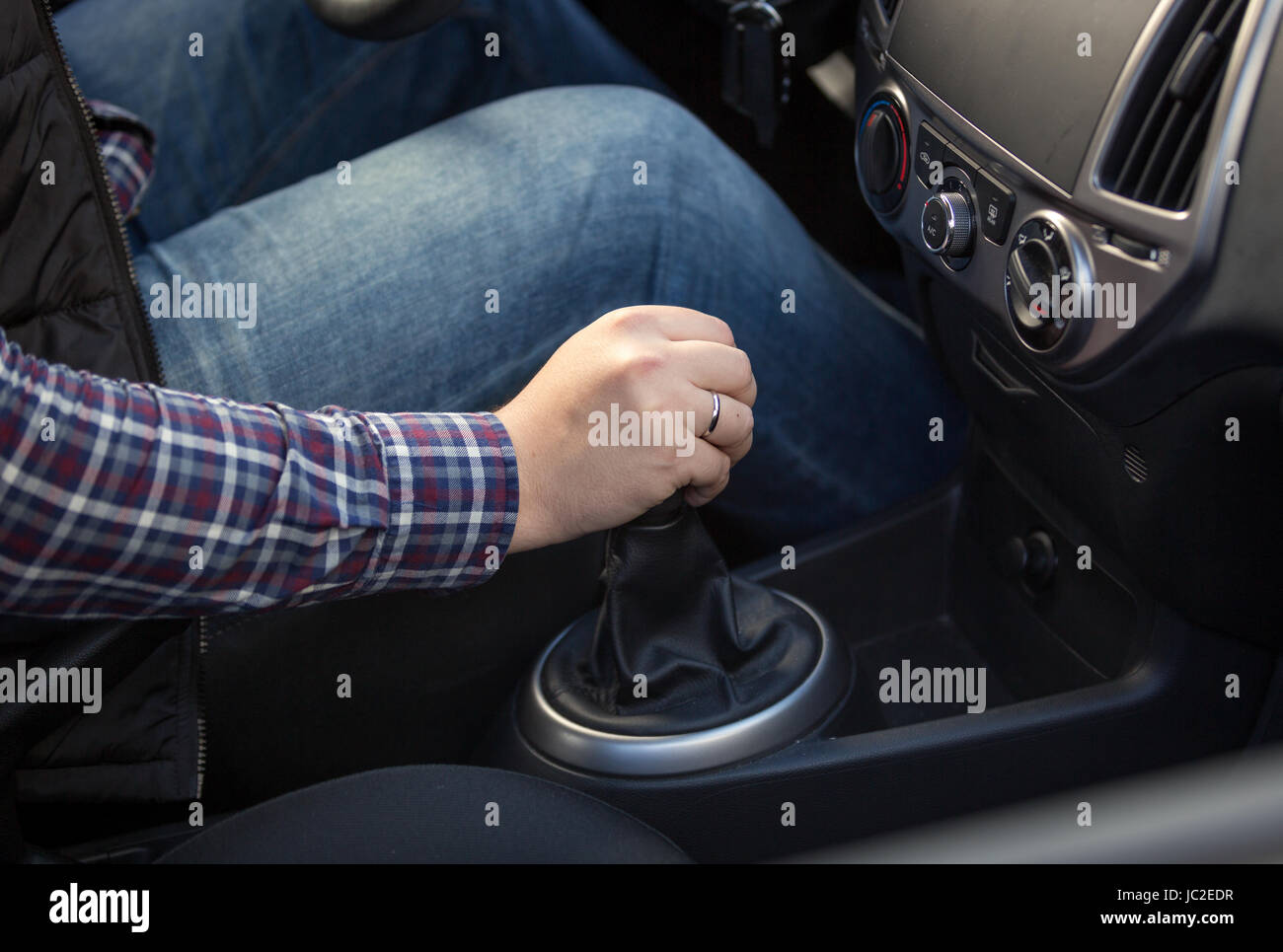 Closeup shot of young man shifting manual gearbox in car Stock Photo ...