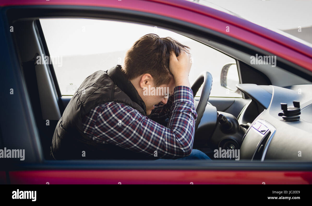 Closeup portrait of depressed man driving car Stock Photo - Alamy