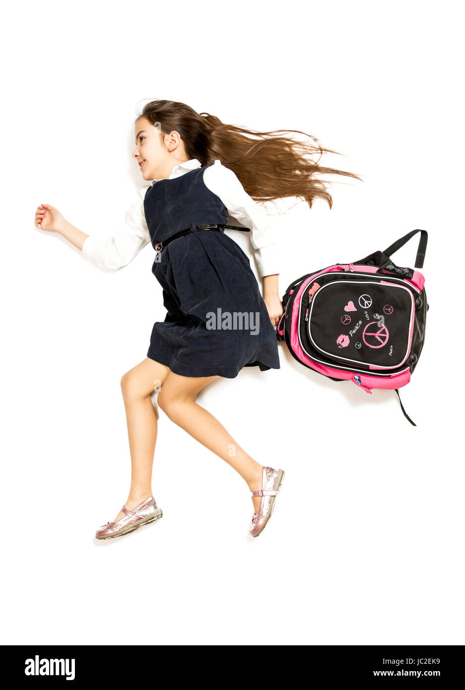 Isolated photo of cute schoolgirl being late and running to school with ...