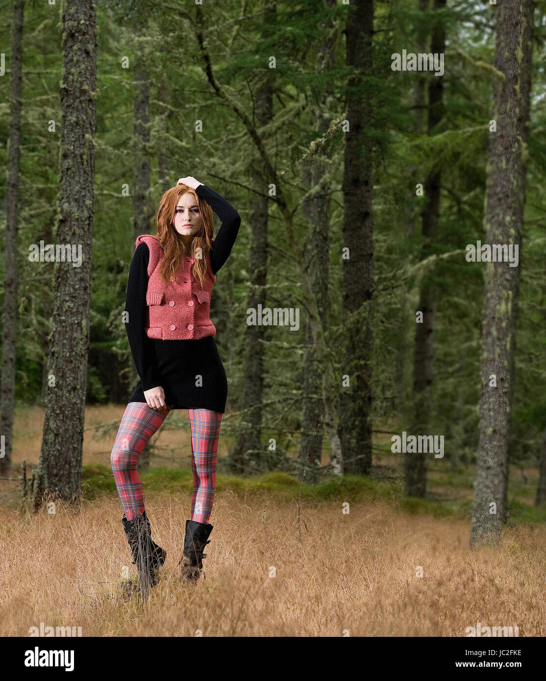 Ginger young woman fashion shoot on location Stock Photo - Alamy