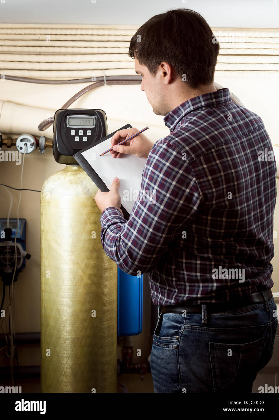 Construction worker inspecting pumps hi-res stock photography and ...