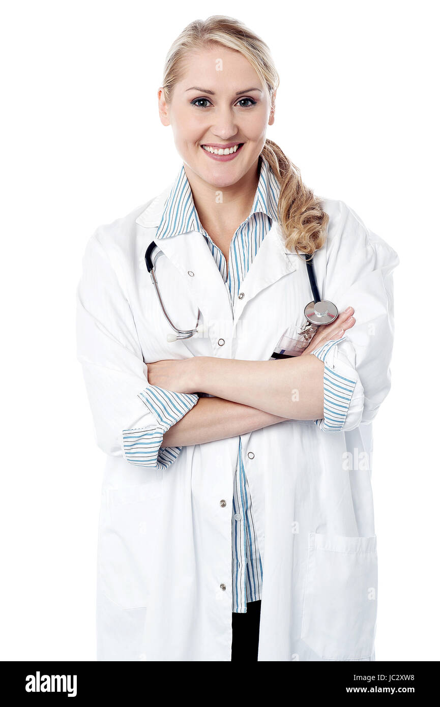 Smiling female doctor posing with folded arms Stock Photo - Alamy