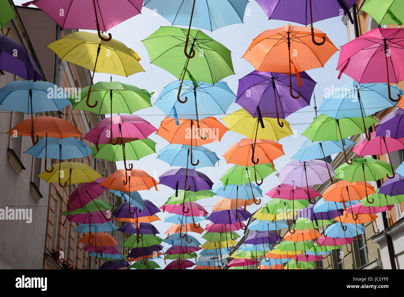 Street decorated with colored umbrellas Stock Photo - Alamy