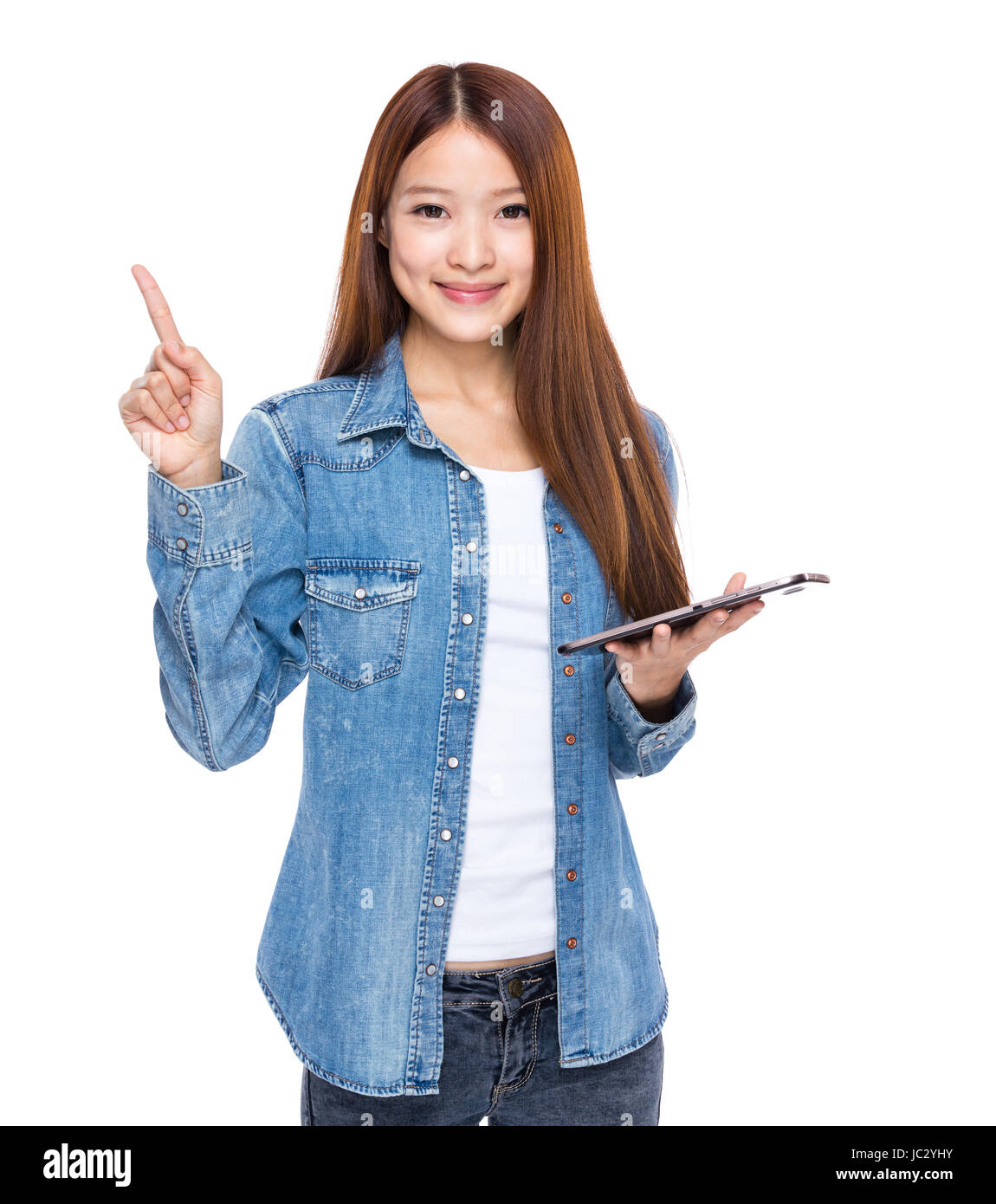 Woman hold tablet with finger point out Stock Photo - Alamy