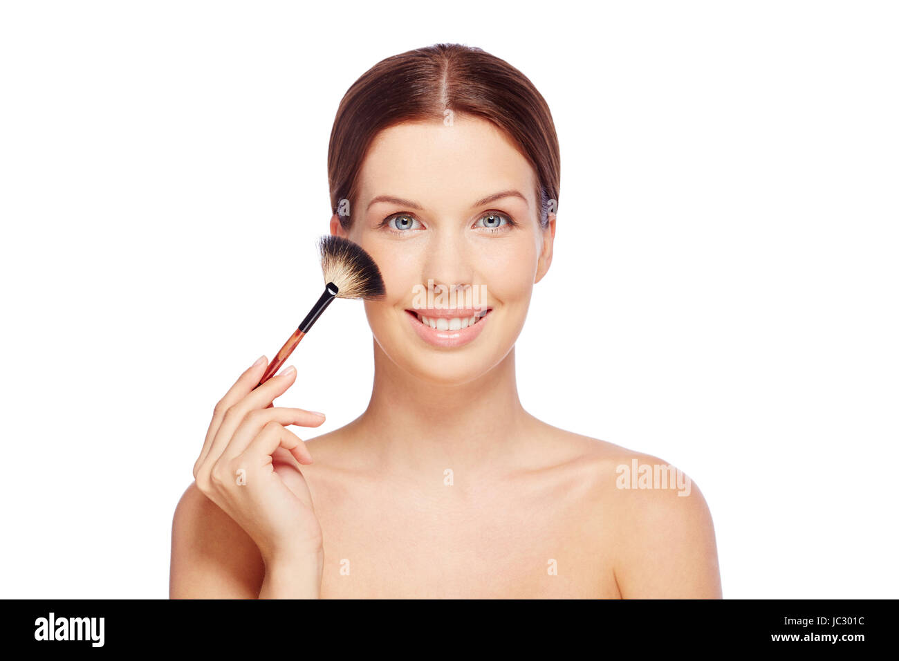 Woman applying powder Stock Photo - Alamy