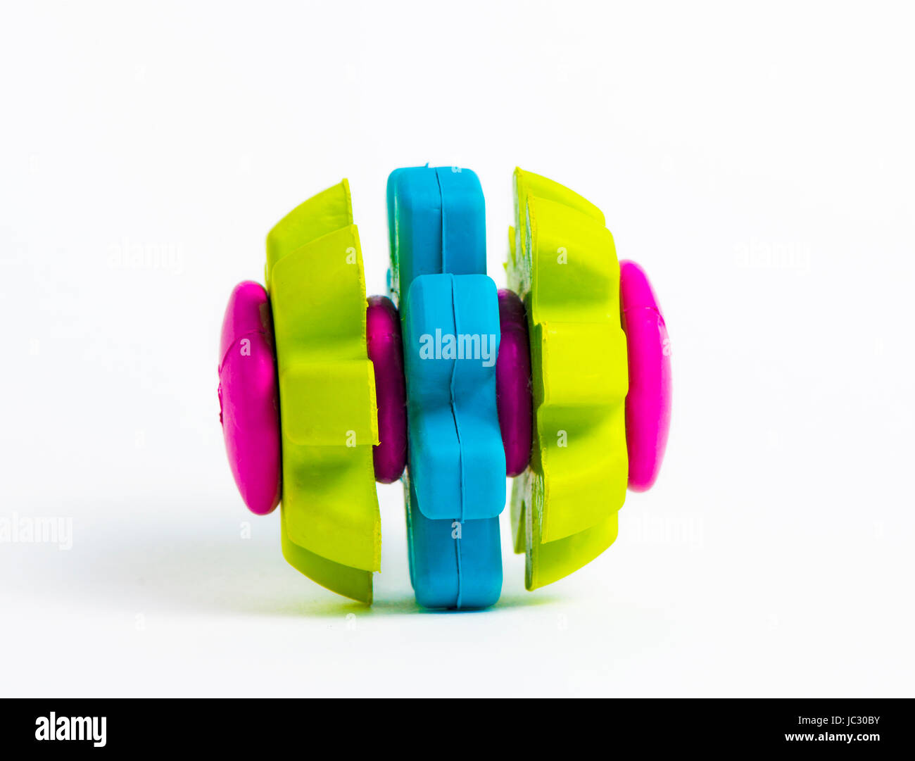 Vivid coloured rubber toy isolated on white background Stock Photo - Alamy