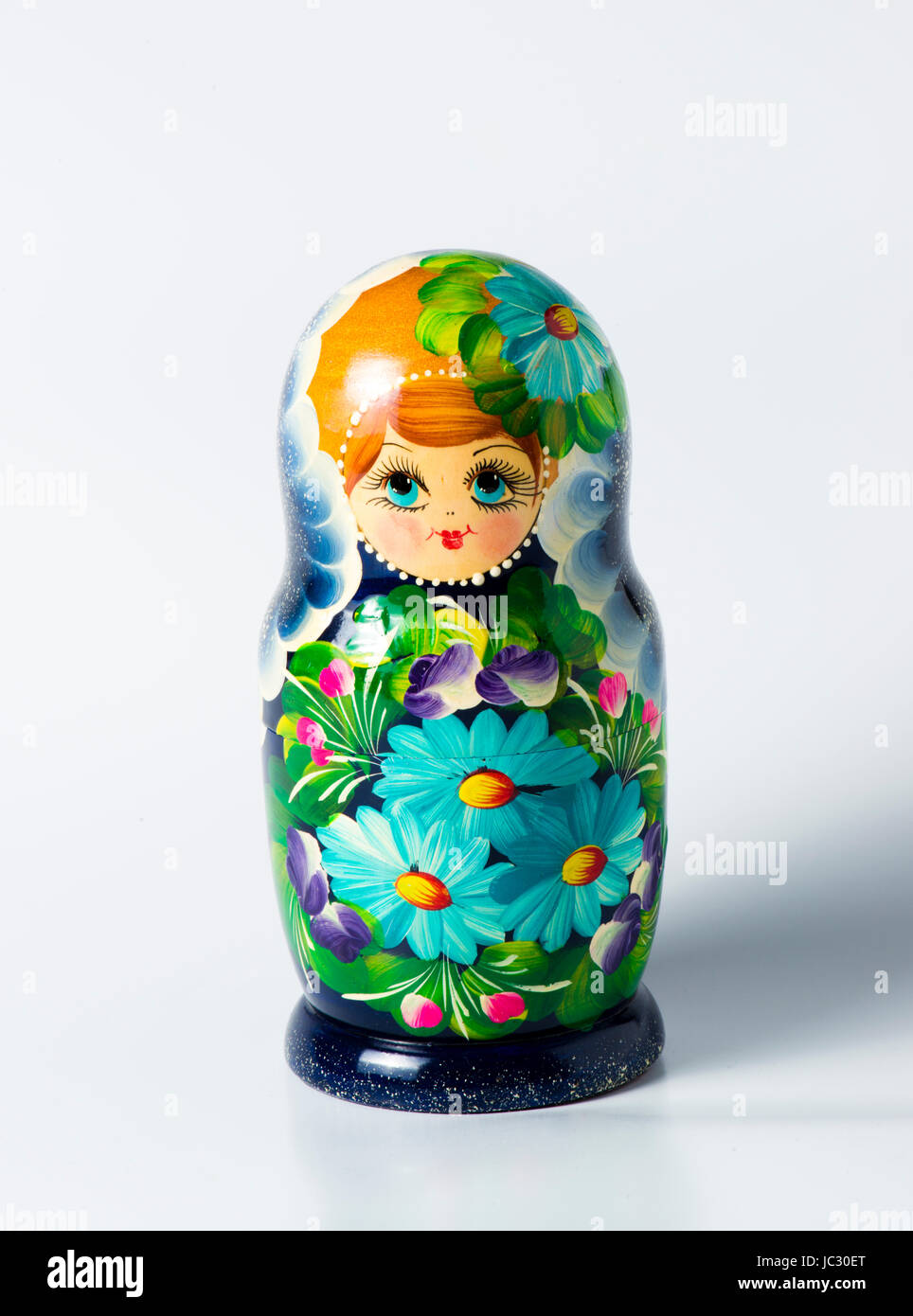 Green matryoshka isolated on white background Stock Photo - Alamy