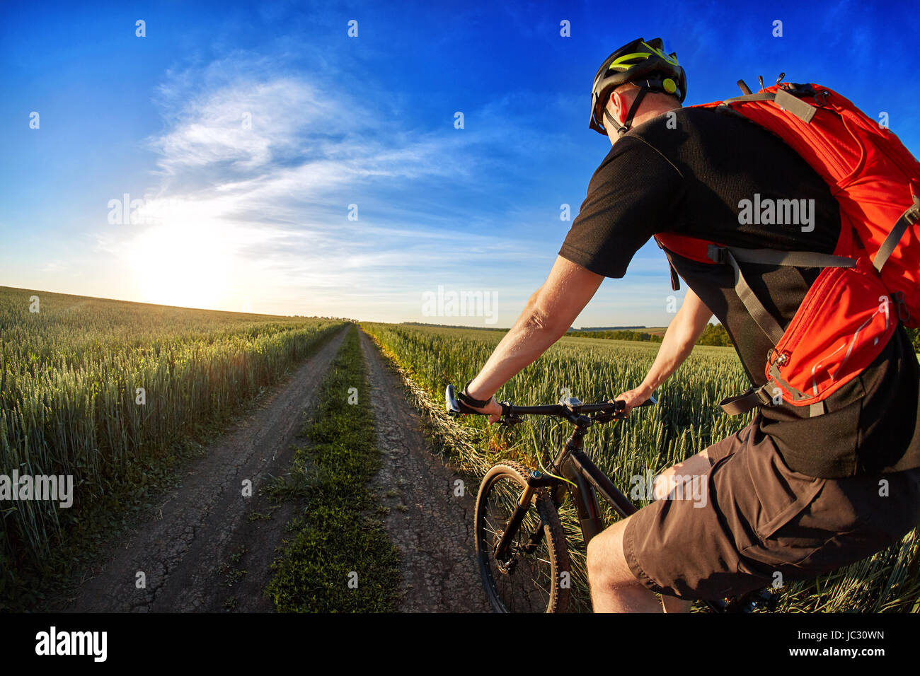 Rear view mountain bike rider hi-res stock photography and images - Alamy