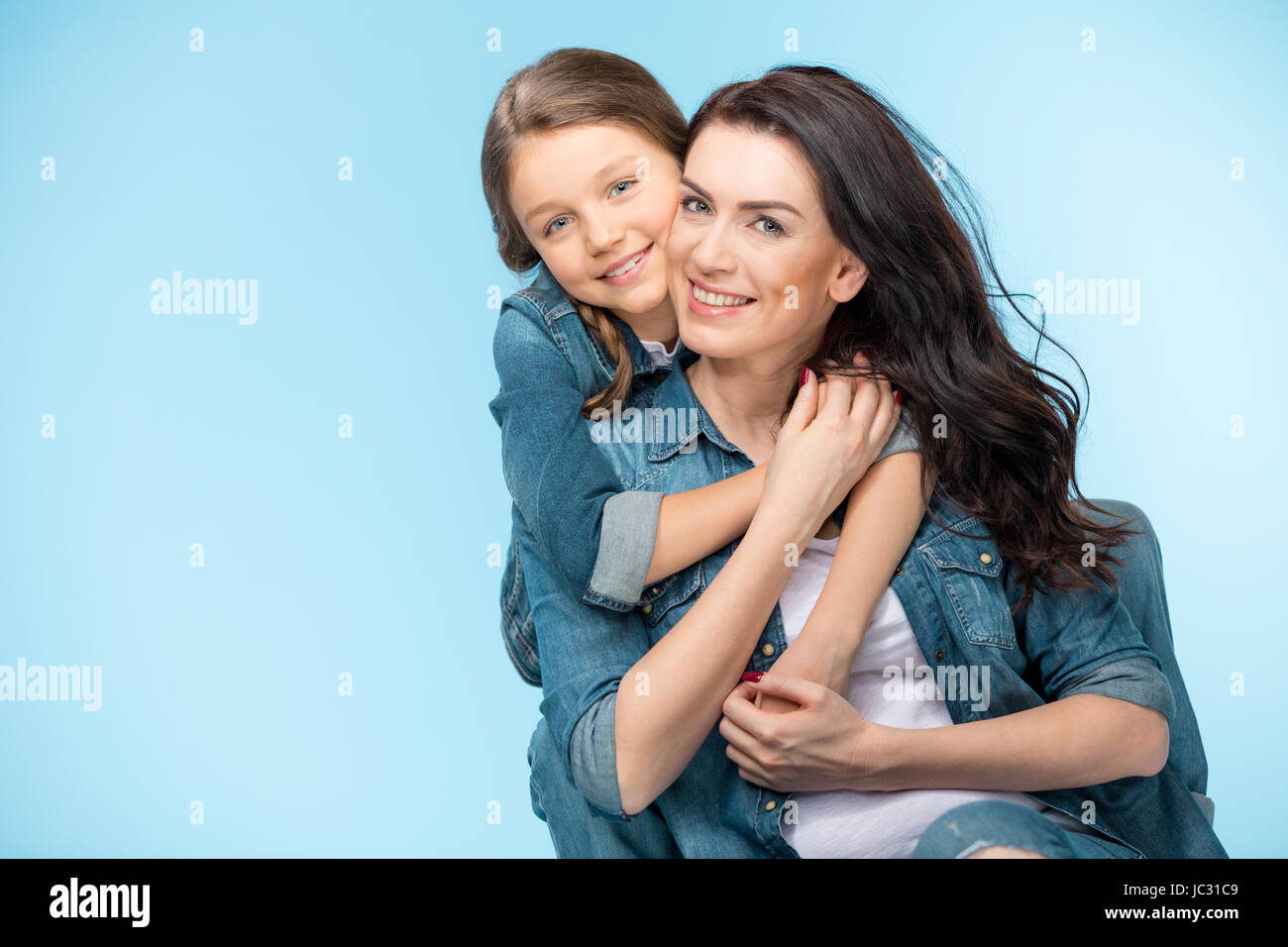 Excited mother hugging kid hi-res stock photography and images - Alamy