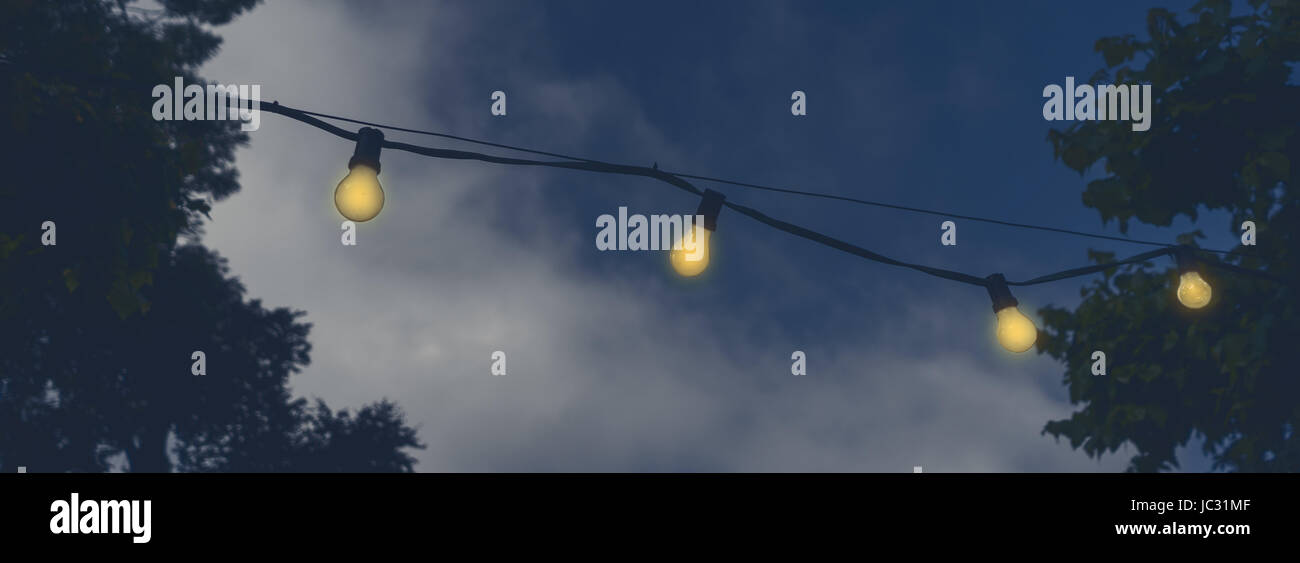 Yellow glowing party lights in the night Stock Photo - Alamy