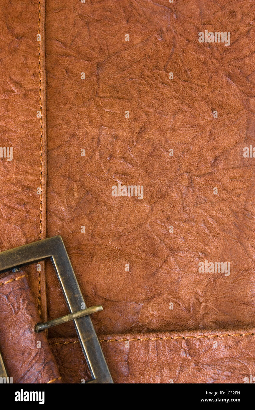 Brown background with leather texture and metal buckle Stock Photo - Alamy