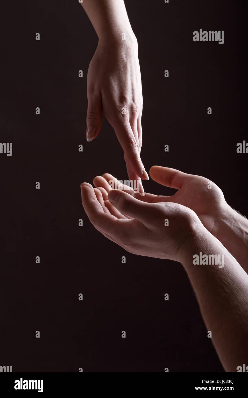 Hands-loving people on a black background Stock Photo - Alamy