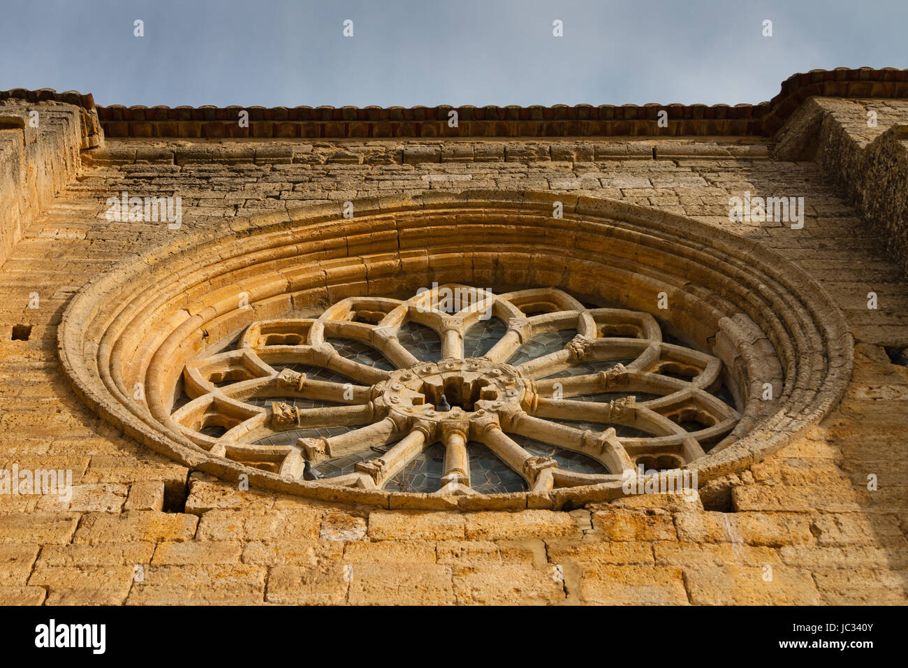Rose window closeup of the romanesque to gothic transition church in ...
