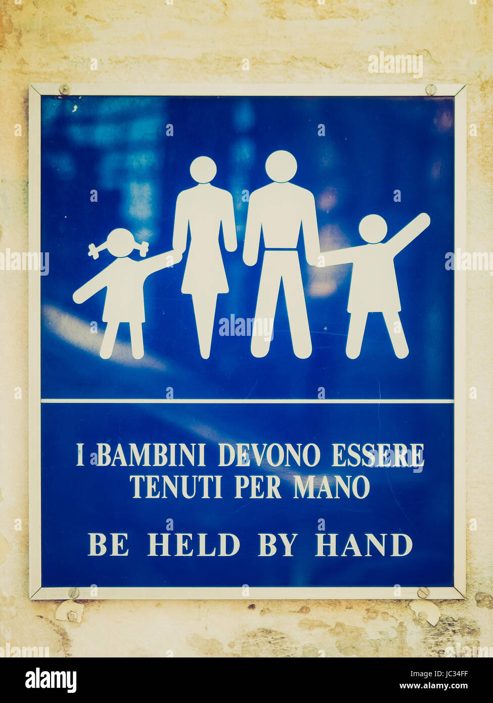 Vintage retro looking Children must be held by hand sign Stock Photo ...