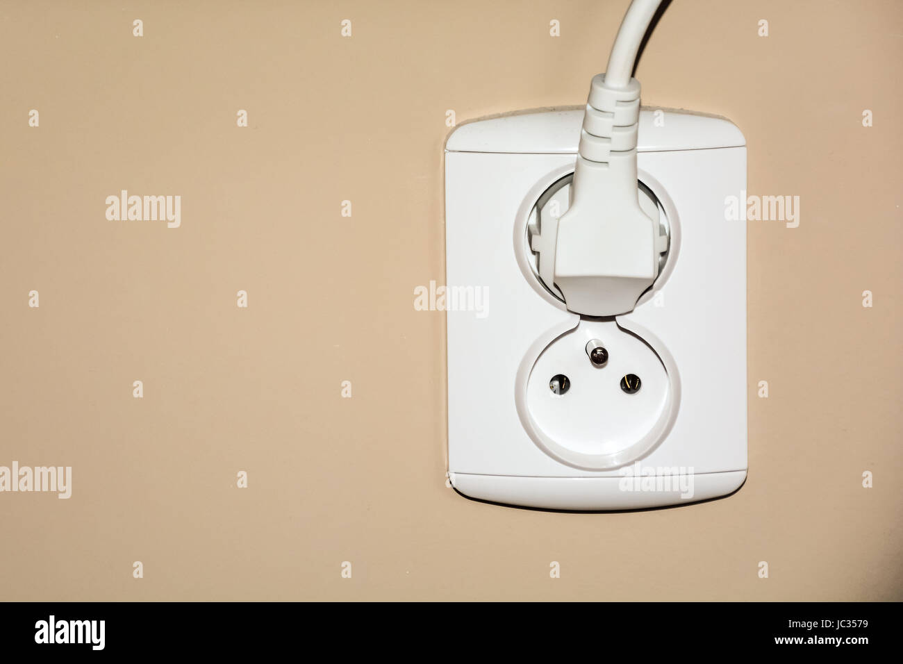 white double electrical socket with plug Stock Photo - Alamy