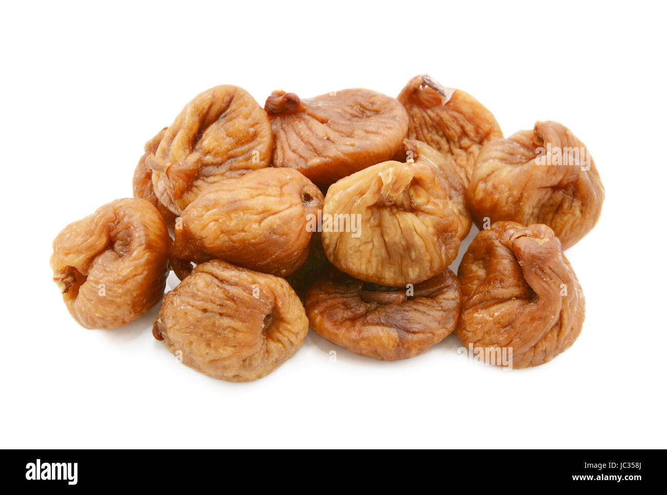 Whole soft dried figs, isolated on a white background Stock Photo - Alamy