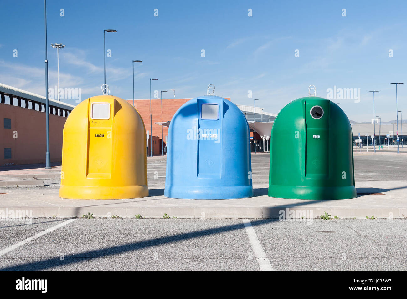 Three Garbage containers for separate types of trash Stock Photo - Alamy
