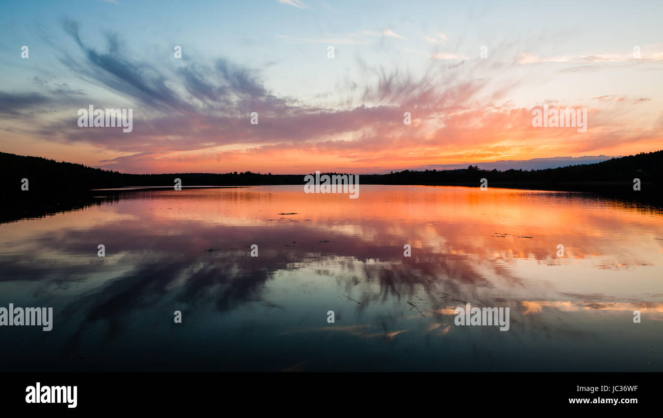 Colorful sunset reflection at lake Stock Photo - Alamy