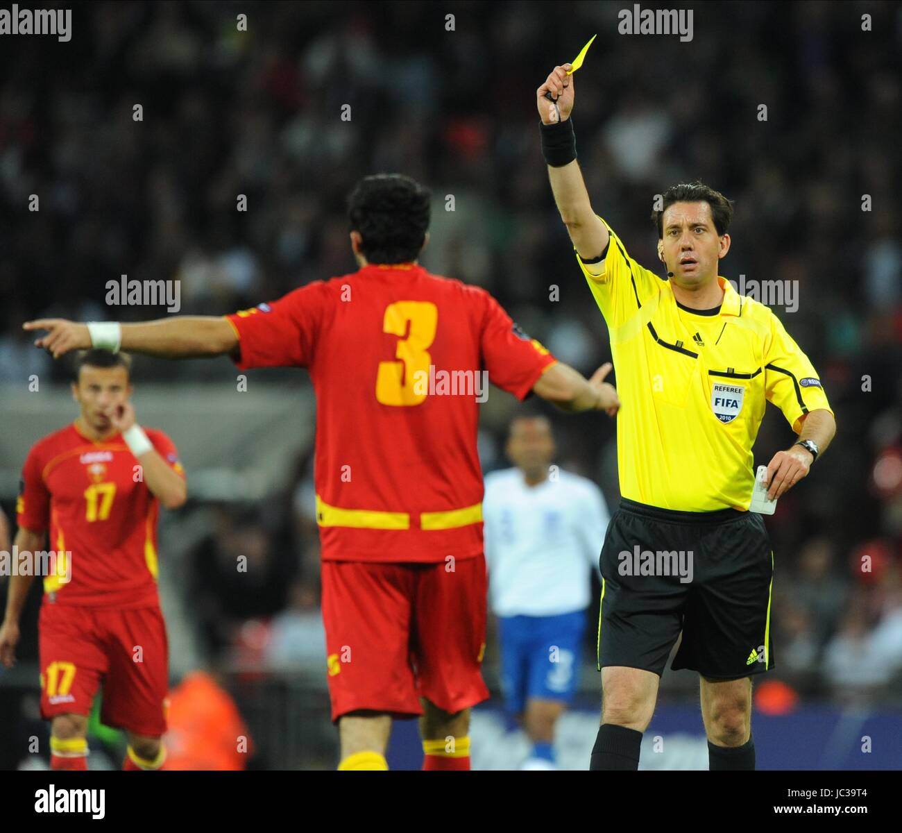 MARKO BASA IS BOOKED BY REFERE ENGLAND V MONTENEGRO WEMBLEY STADIUM ...