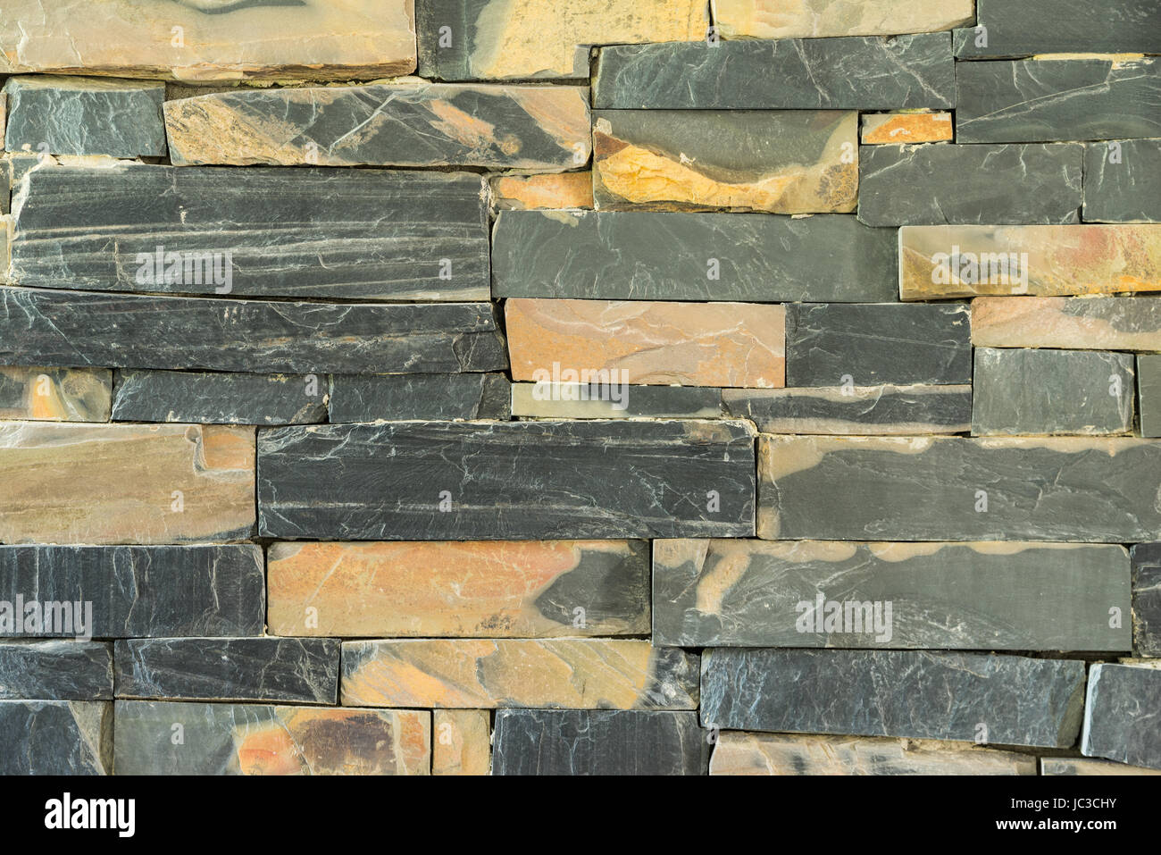 Pattern of black granite stone wall surface background Stock Photo - Alamy