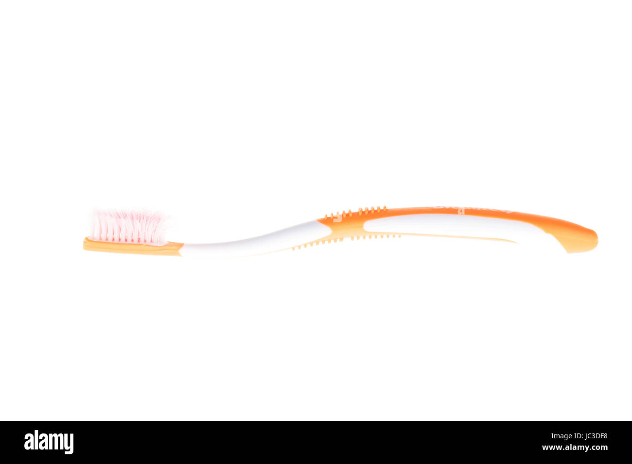 Orange worn toothbrush on white background Stock Photo - Alamy