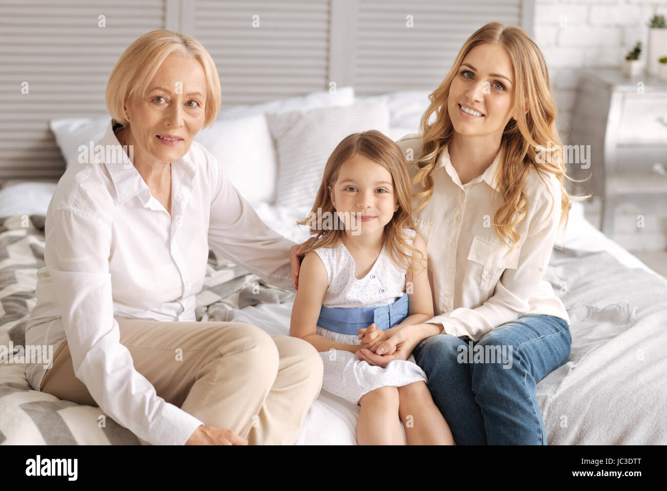 Charming three generations of women bonding Stock Photo - Alamy