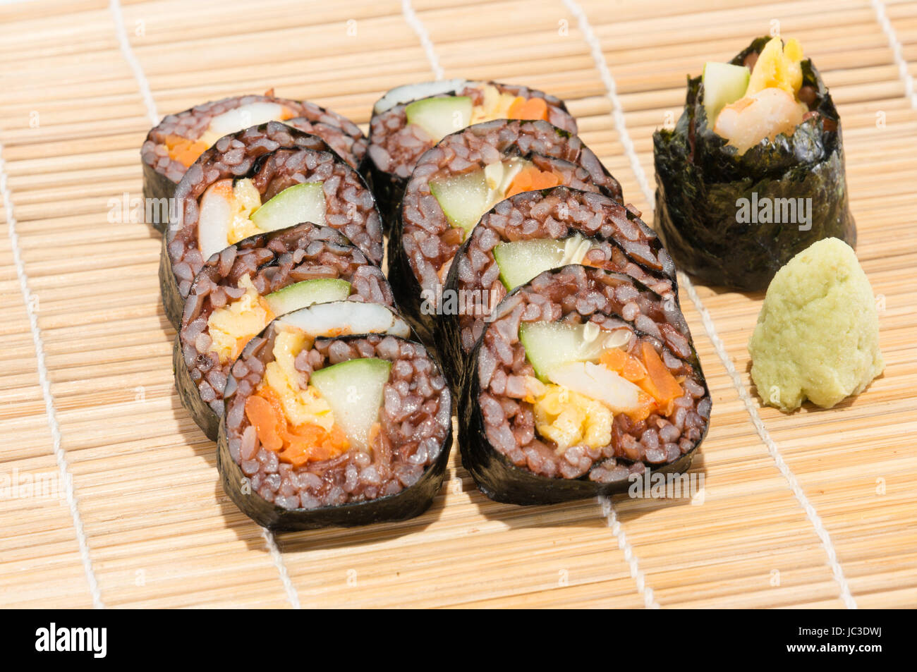Suchi roll with vegetable and coast rice inside beside wasabi Stock ...
