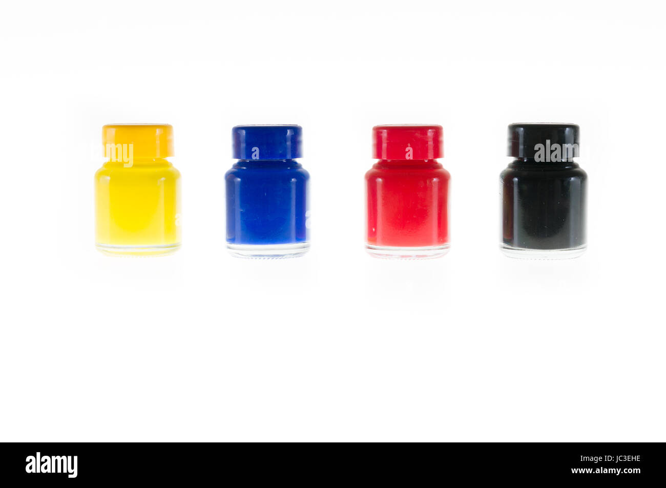 Bottles of ink in cmyk colors Stock Photo - Alamy