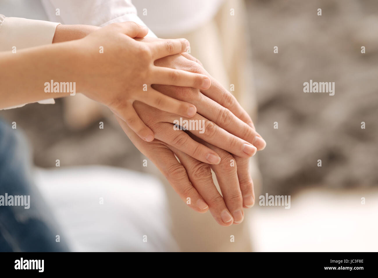 Delicate female hands of three generations Stock Photo - Alamy