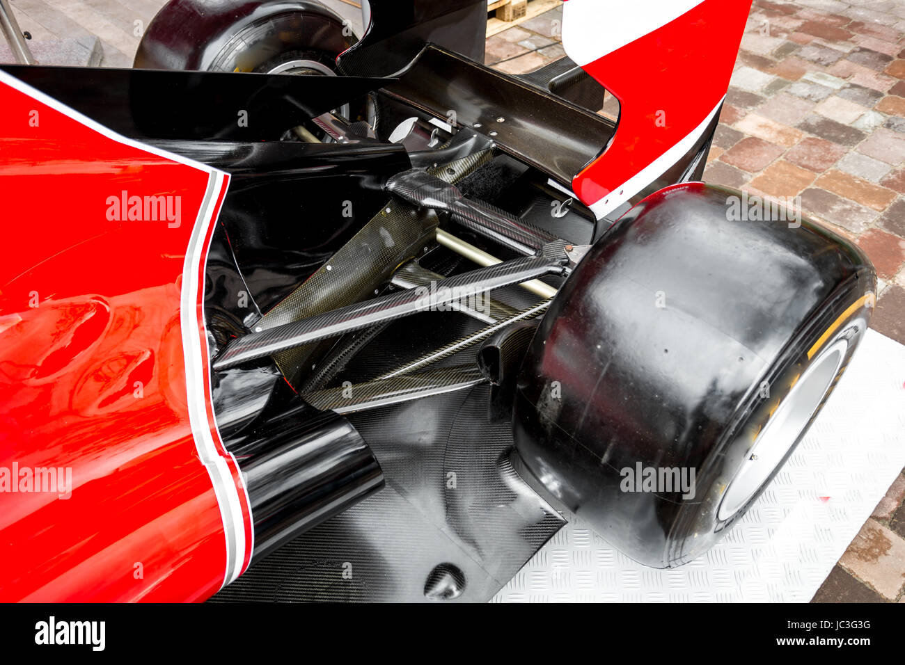 Closeup shot of formula one wheel on red car Stock Photo - Alamy