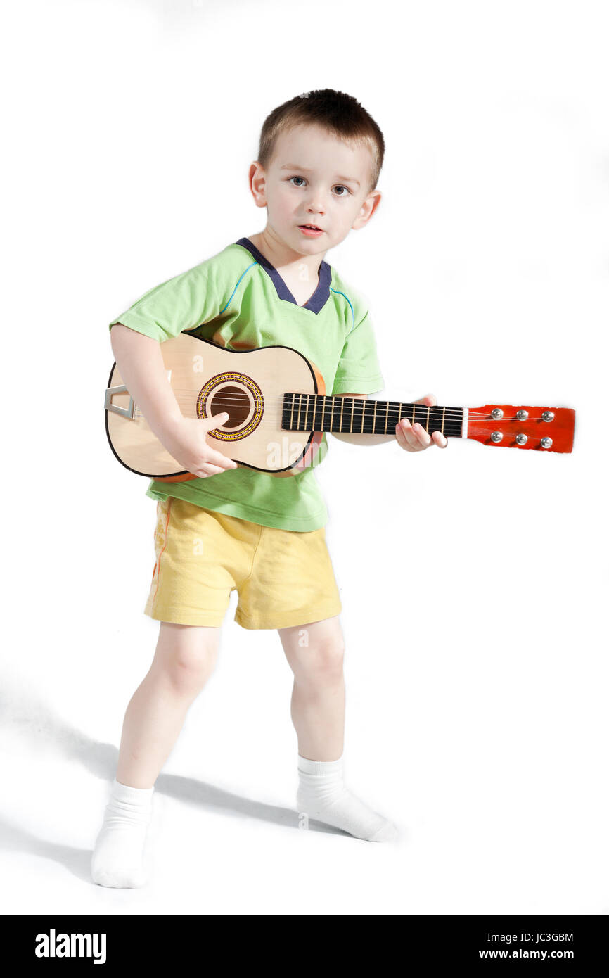 Child playing on guitar isolated on a white background Stock Photo - Alamy
