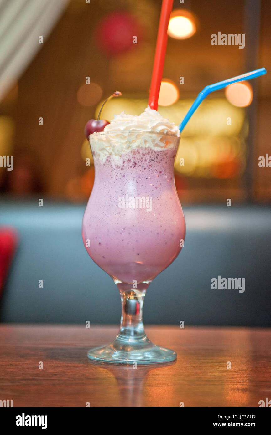 Cherry milkshake with fresh fruits Stock Photo - Alamy