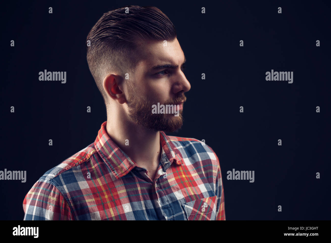 Side view portrait of thinking stylish young man looking away Stock ...