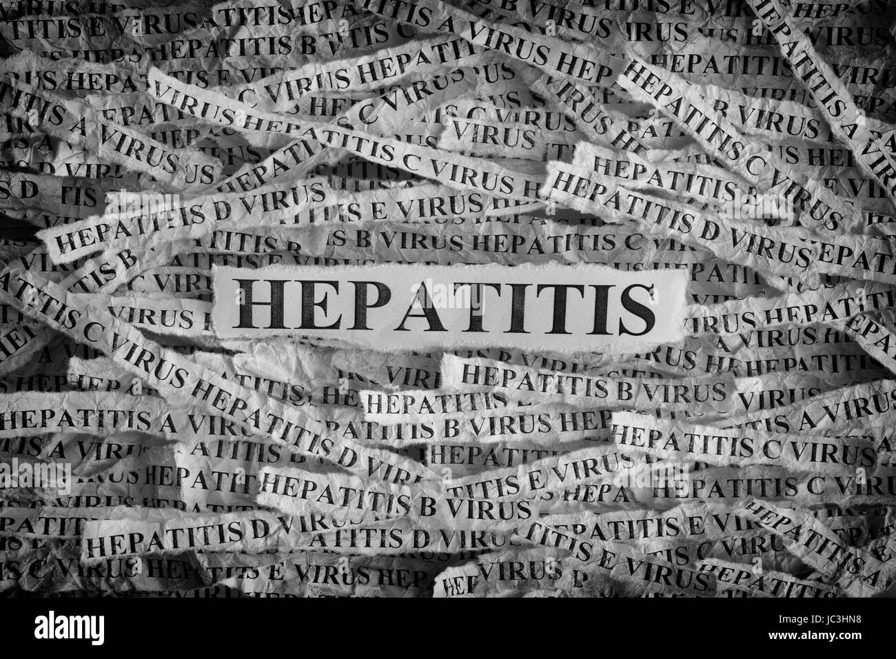 Hepatitis. Torn pieces of paper with the words Hepatitis. Concept Image ...