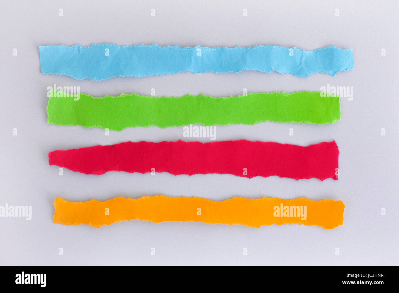 Torn colorful paper strips. Close up Stock Photo - Alamy