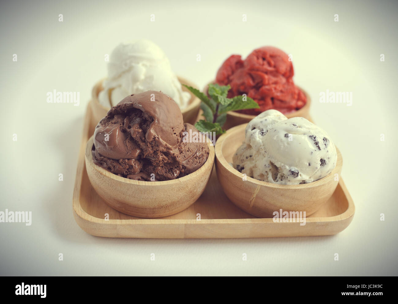 Homemade mixed Ice cream scoops on wooden bowl Stock Photo - Alamy