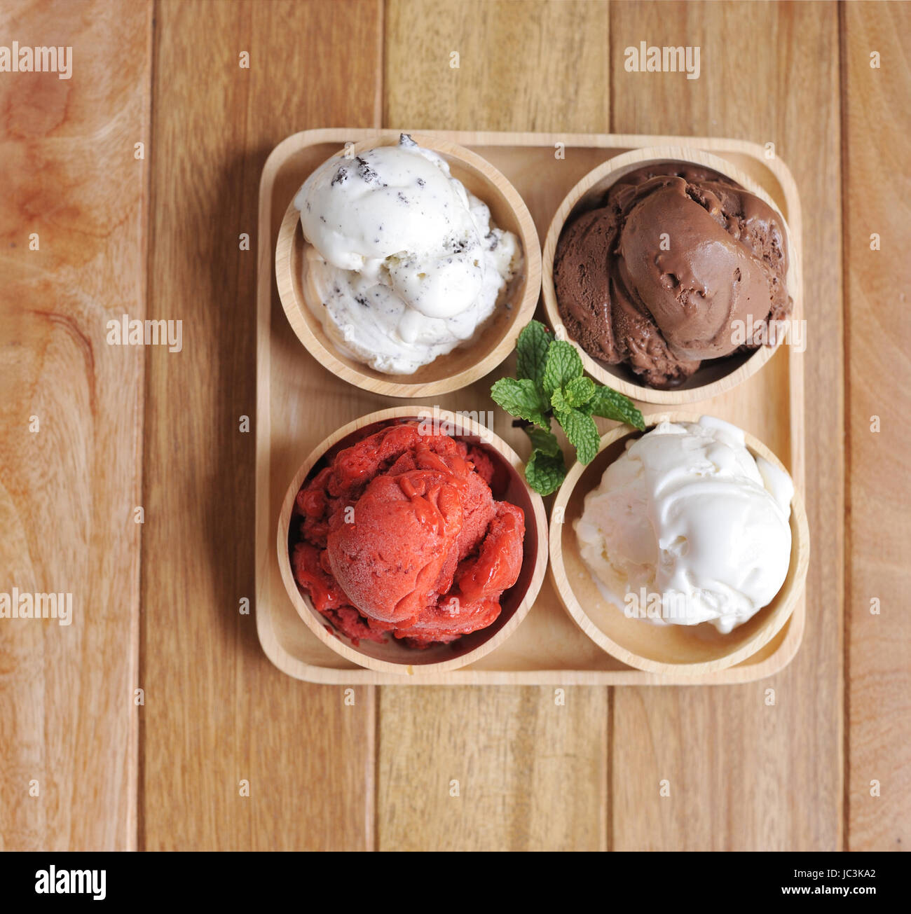 Homemade mixed Ice cream scoops on wooden bowl Stock Photo - Alamy