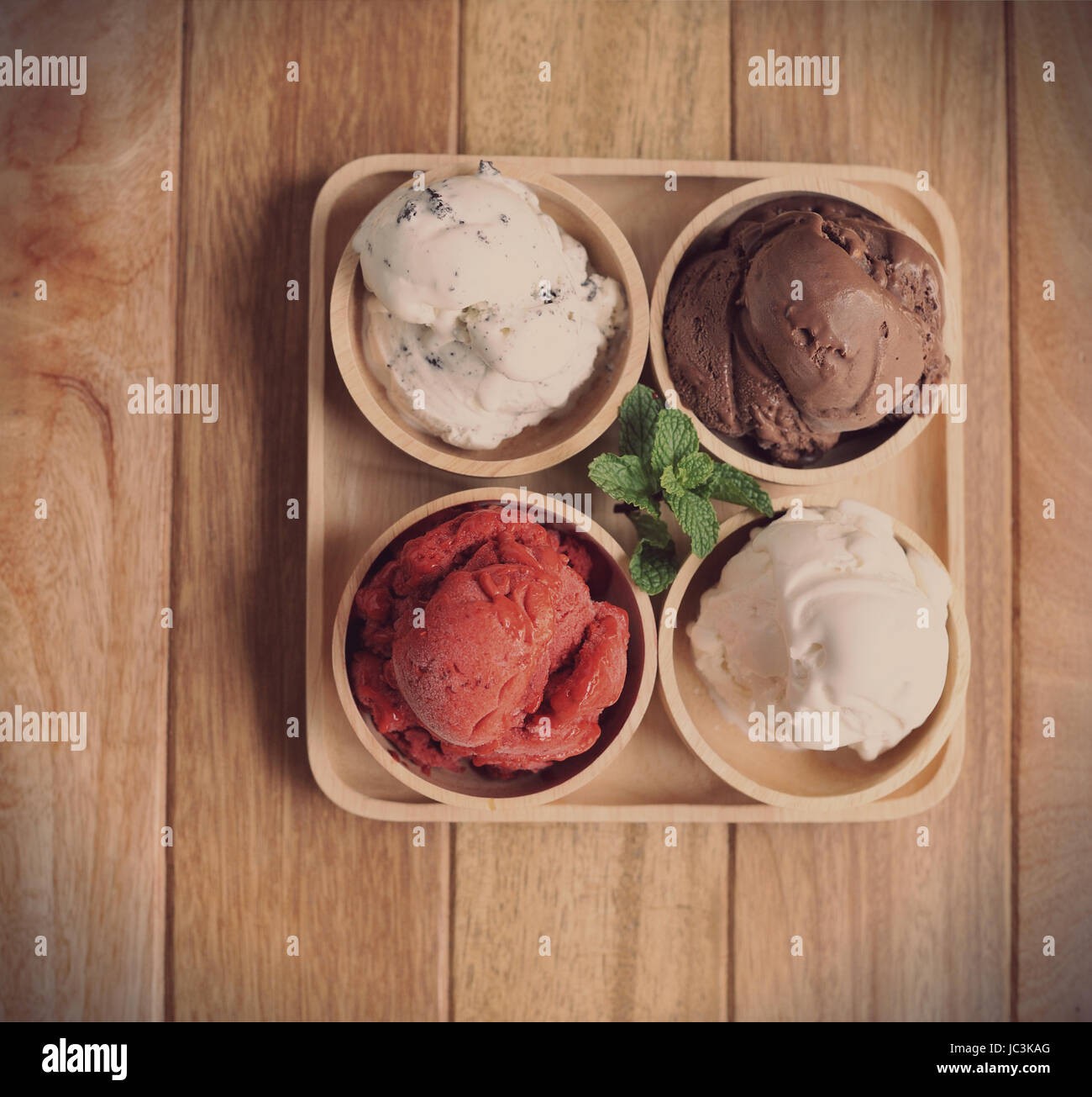 Homemade mixed Ice cream scoops on wooden bowl Stock Photo - Alamy