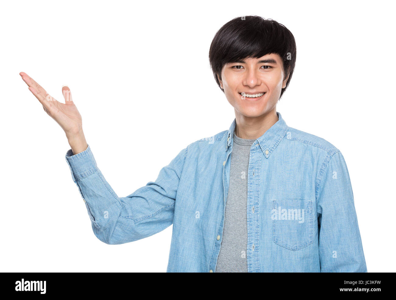 Young man with hand presentation Stock Photo - Alamy