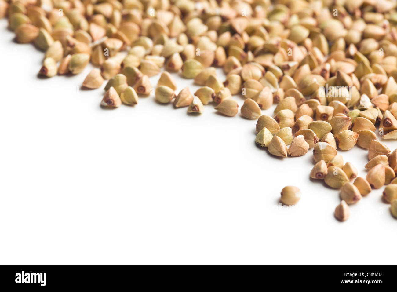uncooked buckwheat on white background Stock Photo - Alamy