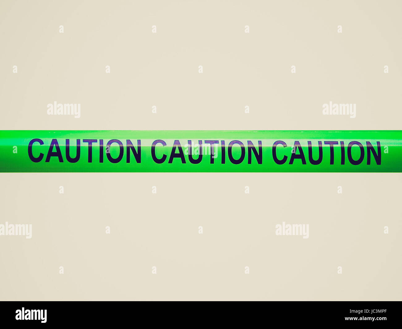 Vintage retro looking Caution tape sign in green isolated over white ...