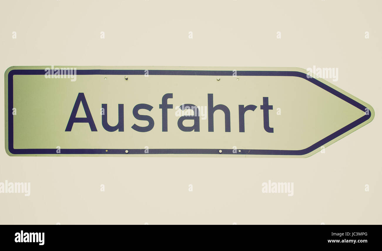 Vintage retro looking traffic sign meaning Exit in German isolated over ...