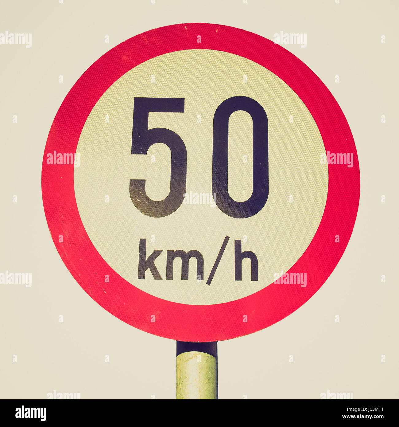 Vintage retro looking Traffic speed limit sign isolated over white ...