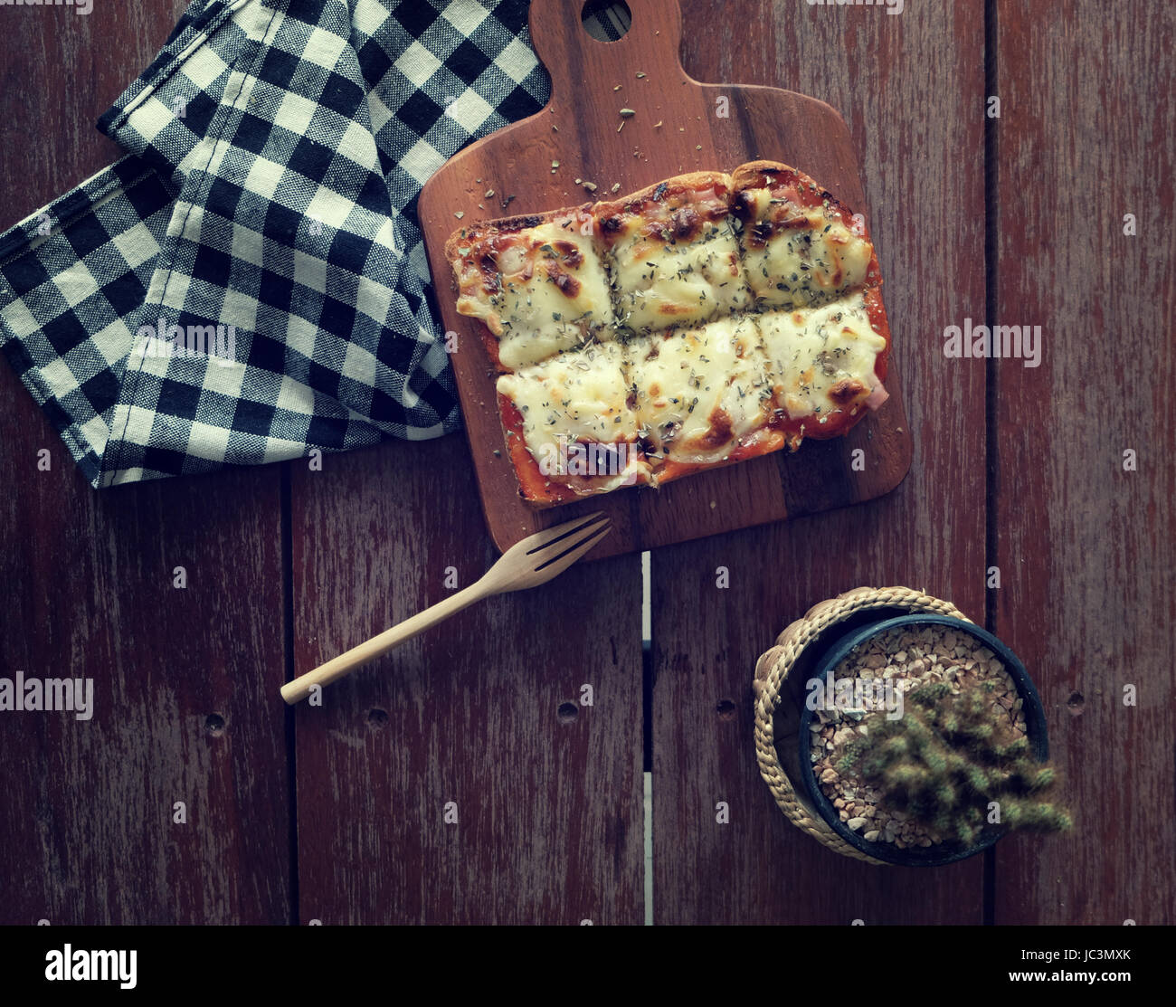 Pizza toasted bread with tomato sauce and ham cheese selective focus ...