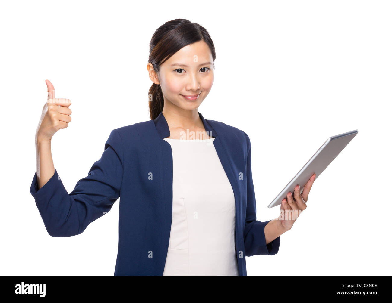 Woman thumb up with tablet Stock Photo - Alamy