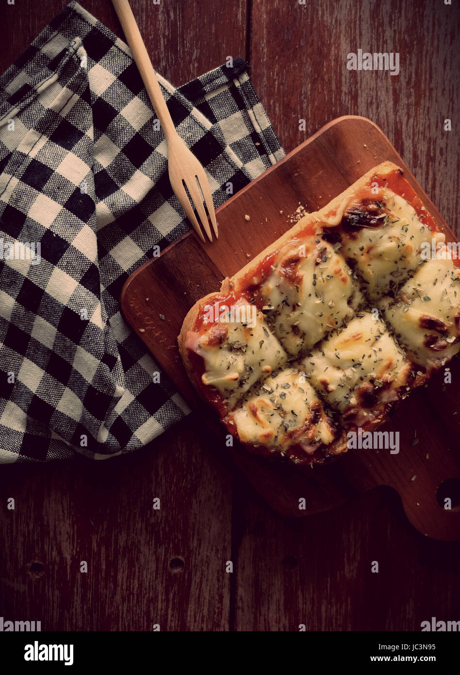 Pizza toasted bread with tomato sauce and ham cheese selective focus ...
