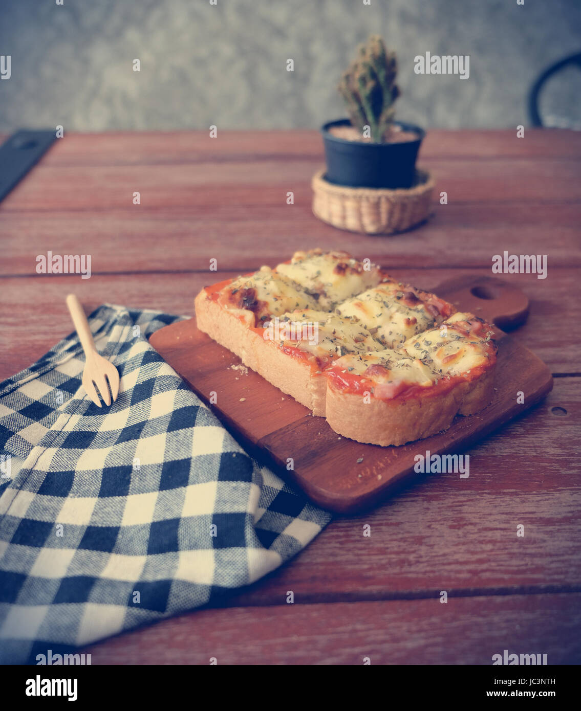 Pizza toasted bread with tomato sauce and ham cheese selective focus ...