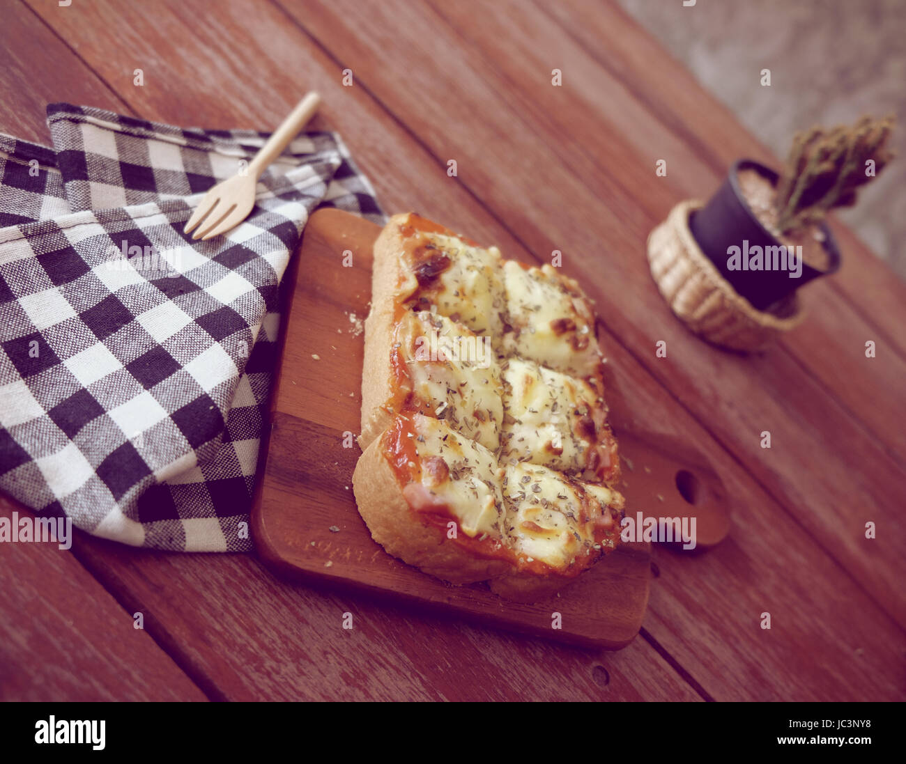 Pizza toasted bread with tomato sauce and ham cheese selective focus ...