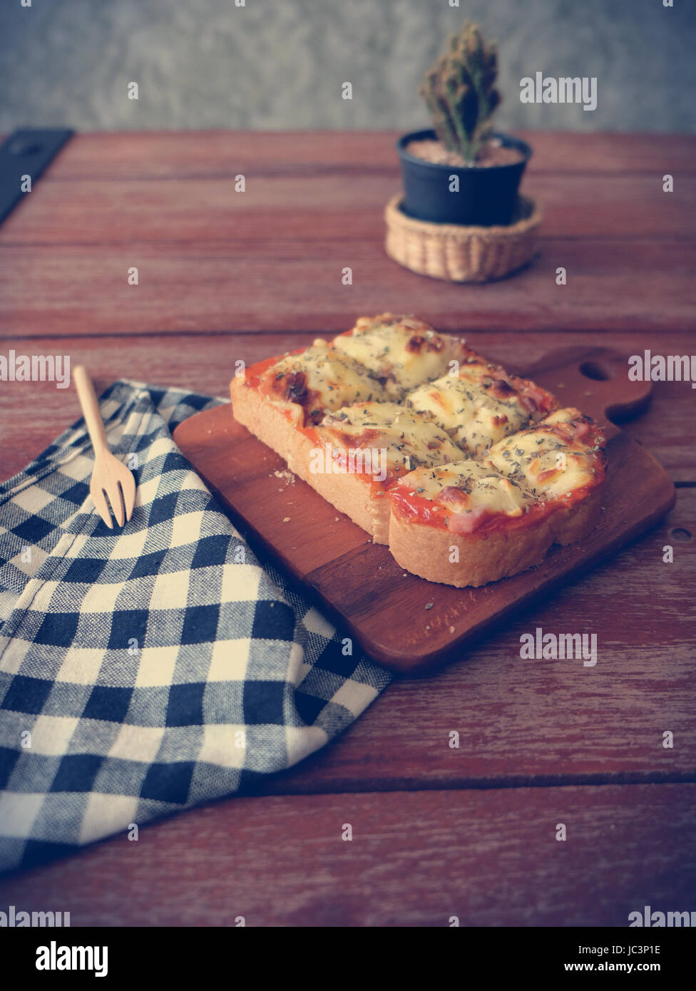 Pizza toasted bread with tomato sauce and ham cheese selective focus ...