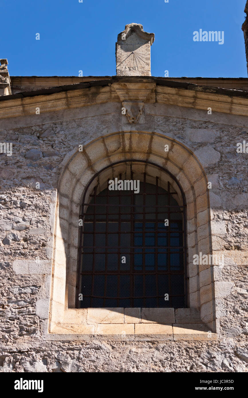 Sundial and wrought iron window in the collegiate church of Santa Maria ...